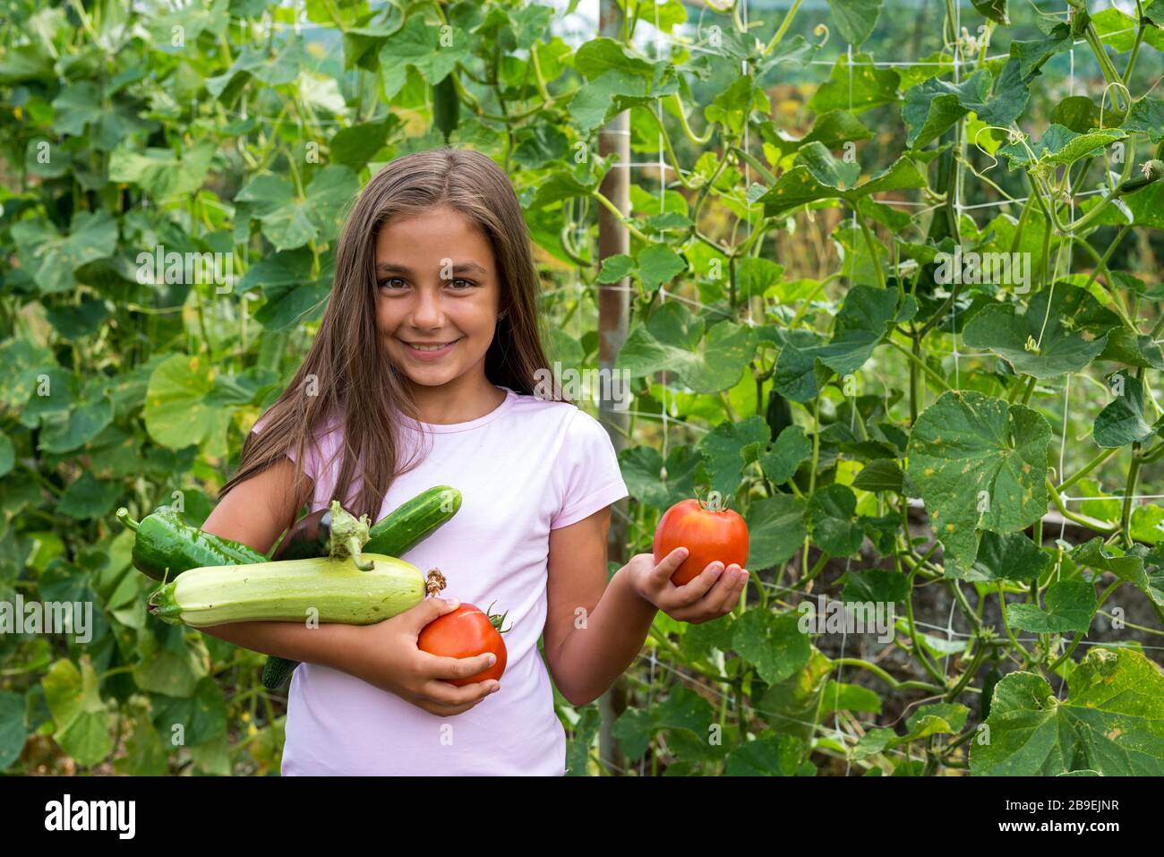 Girl with cucumber hi-res stock photography and images - Alamy