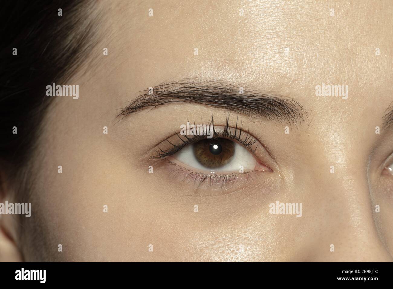 Calm. Close up of face of beautiful caucasian young woman, focus on ...