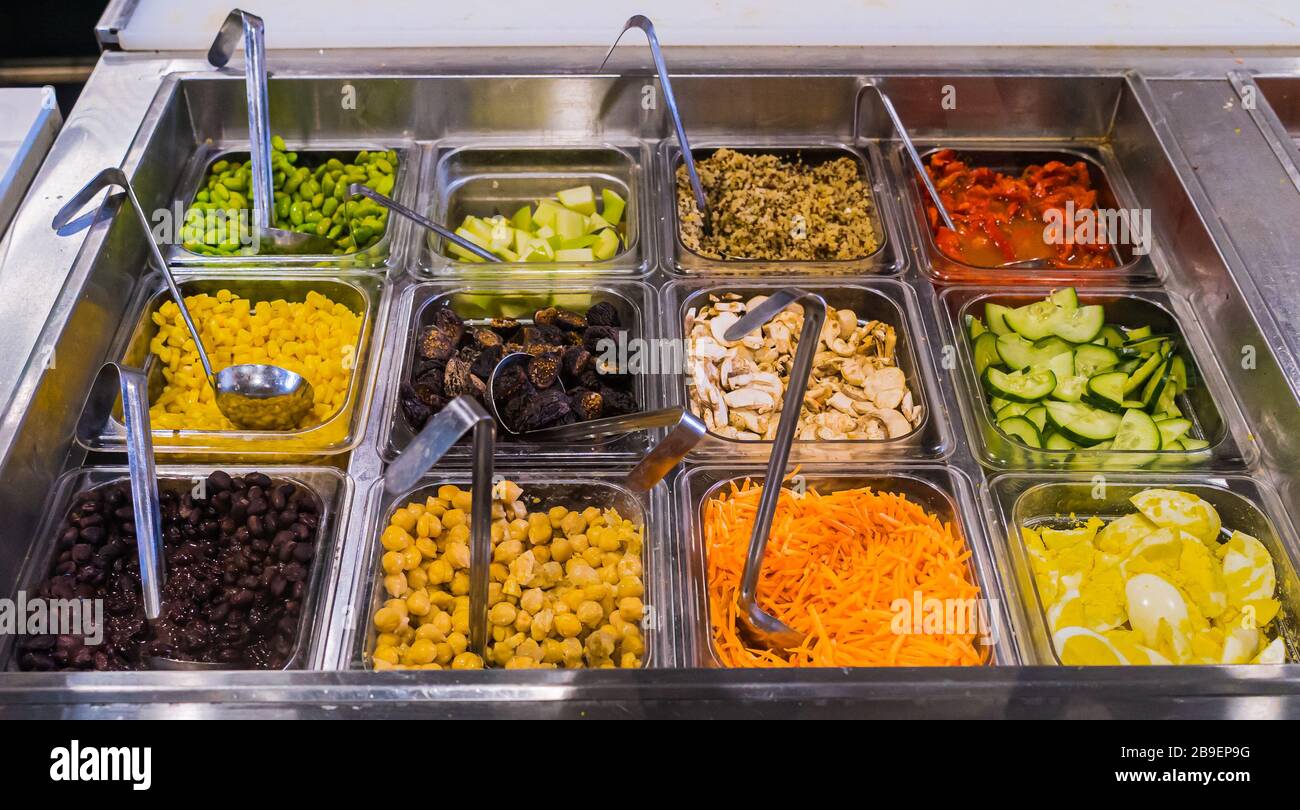 Pizza and salad toppings arranged at a restaurant counter Stock Photo ...