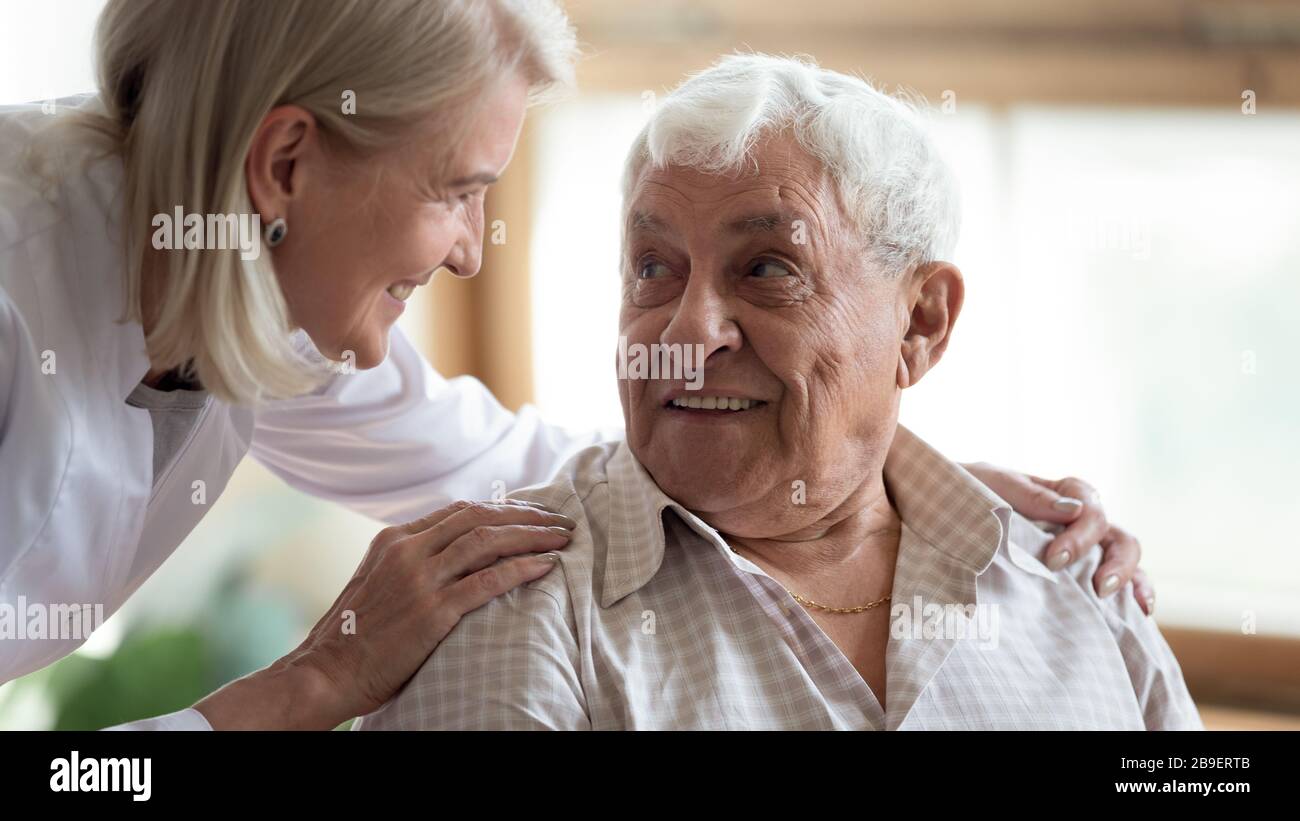 Close up middle-aged female doctor supporting older patient Stock Photo ...