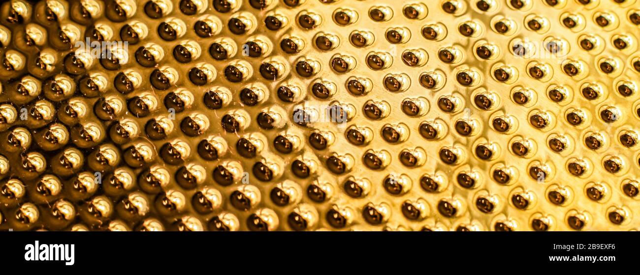 Texture of golden metallic surface as background, materials and ...