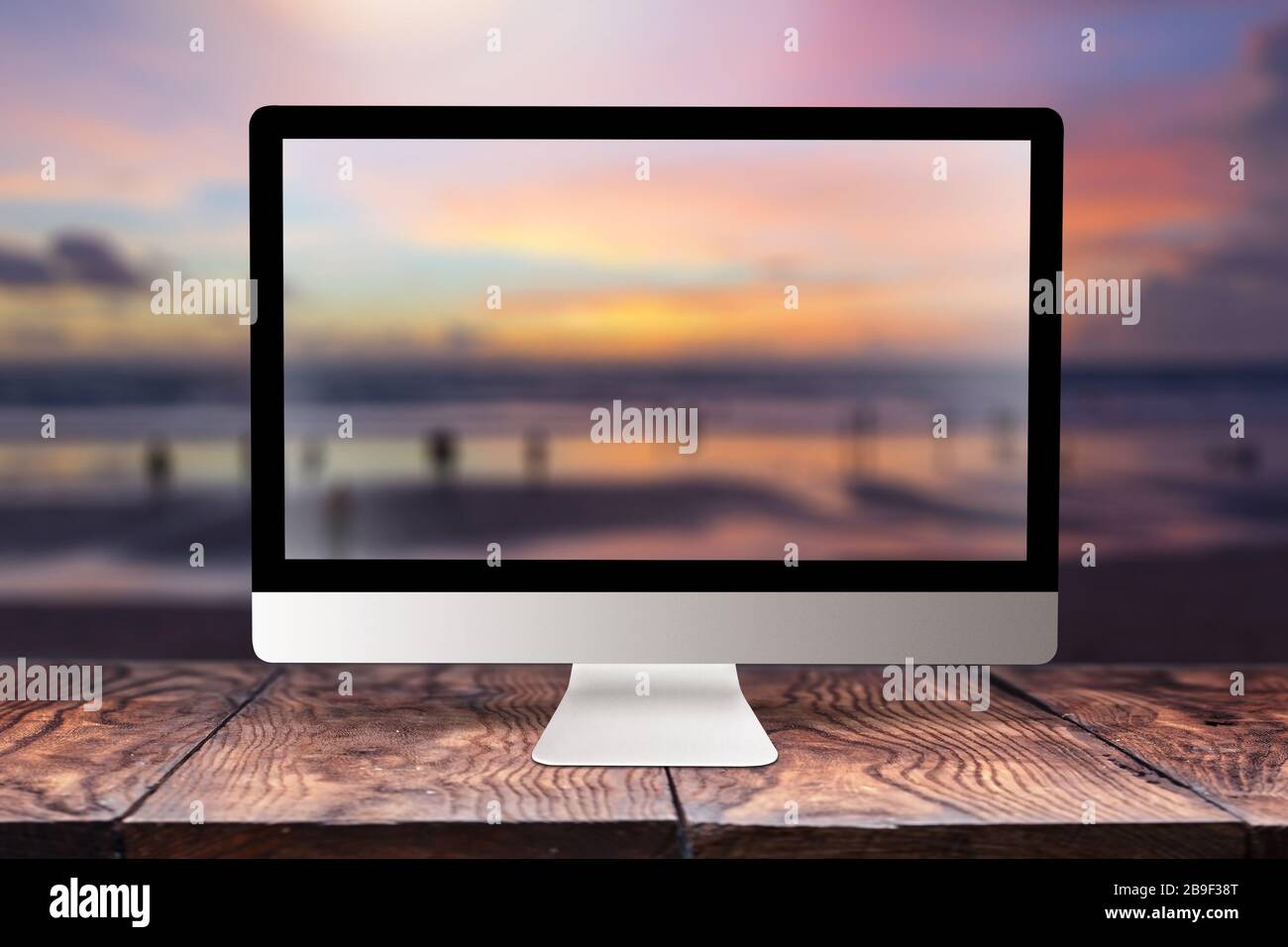 Computer screen with blurred sea background Stock Photo - Alamy