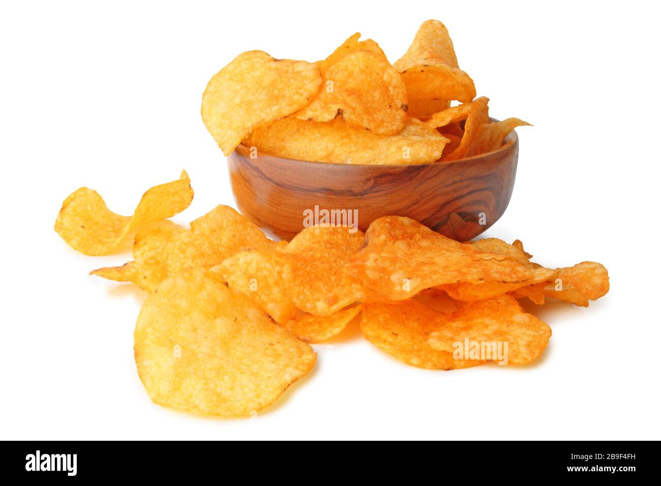 Delicious potato chips in a wooden bowl isolated on white background ...