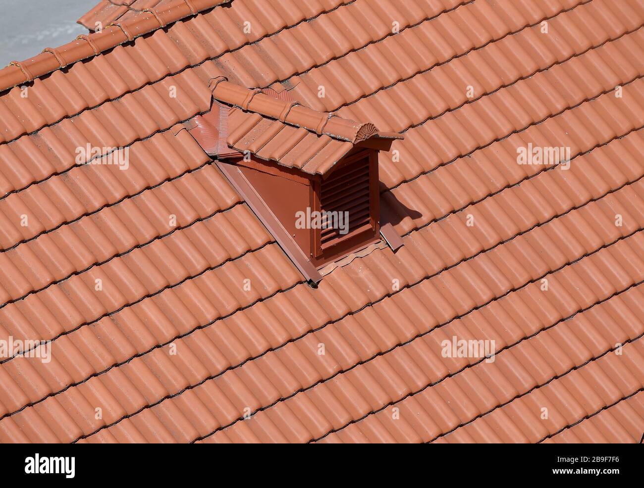 Modern tiled roof for a country house Stock Photo - Alamy