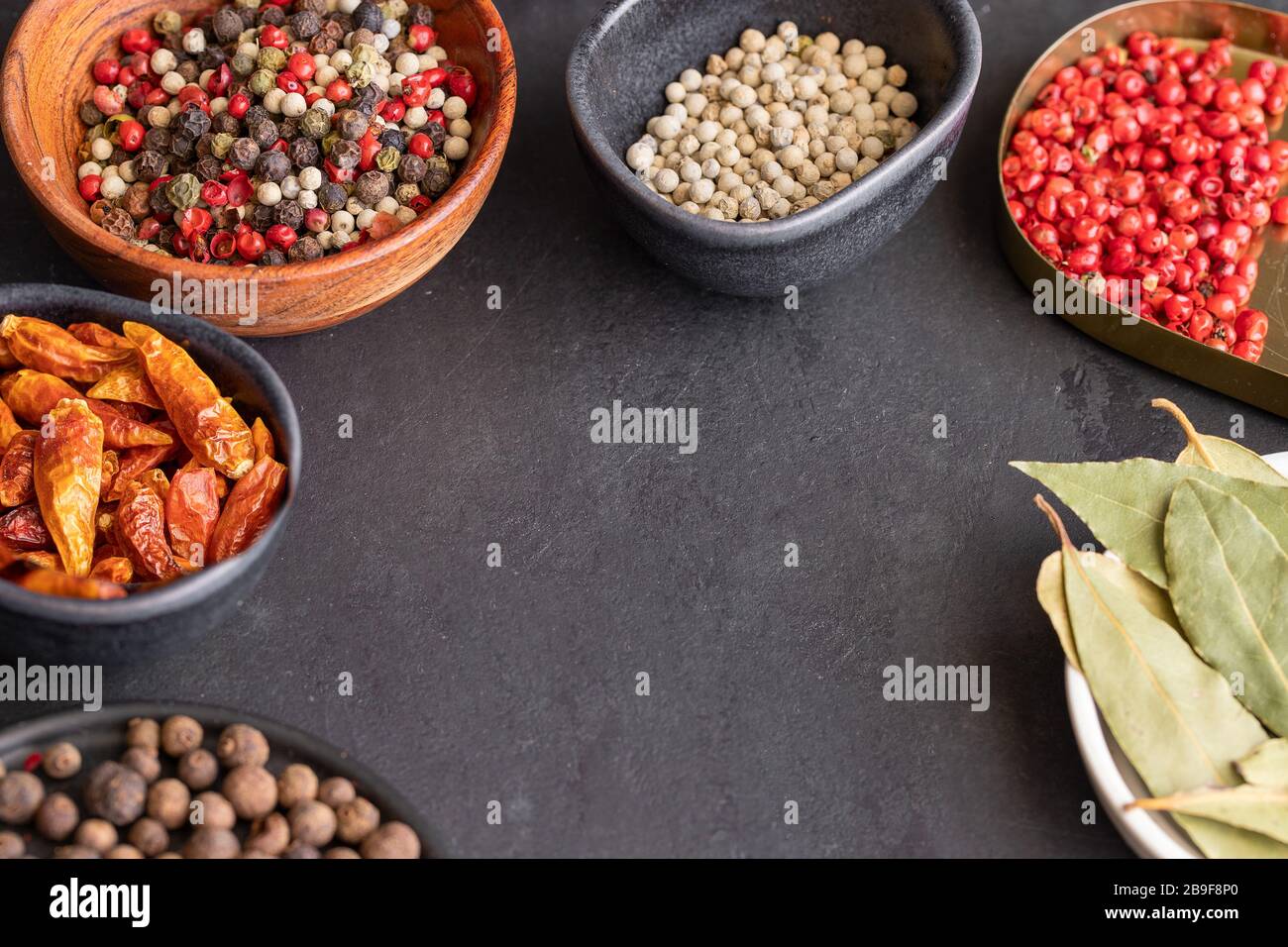 Different spices , pepper type, black ,white, pink ,green, cayenne ...