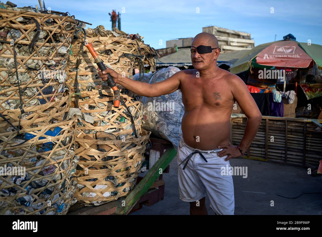 Portrait of a garbage collector with an eye patch in the streets of the ...