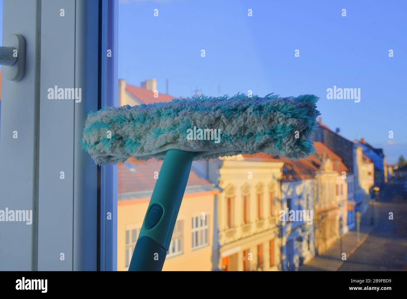 Cleaning windows with a squeegee hi-res stock photography and images ...