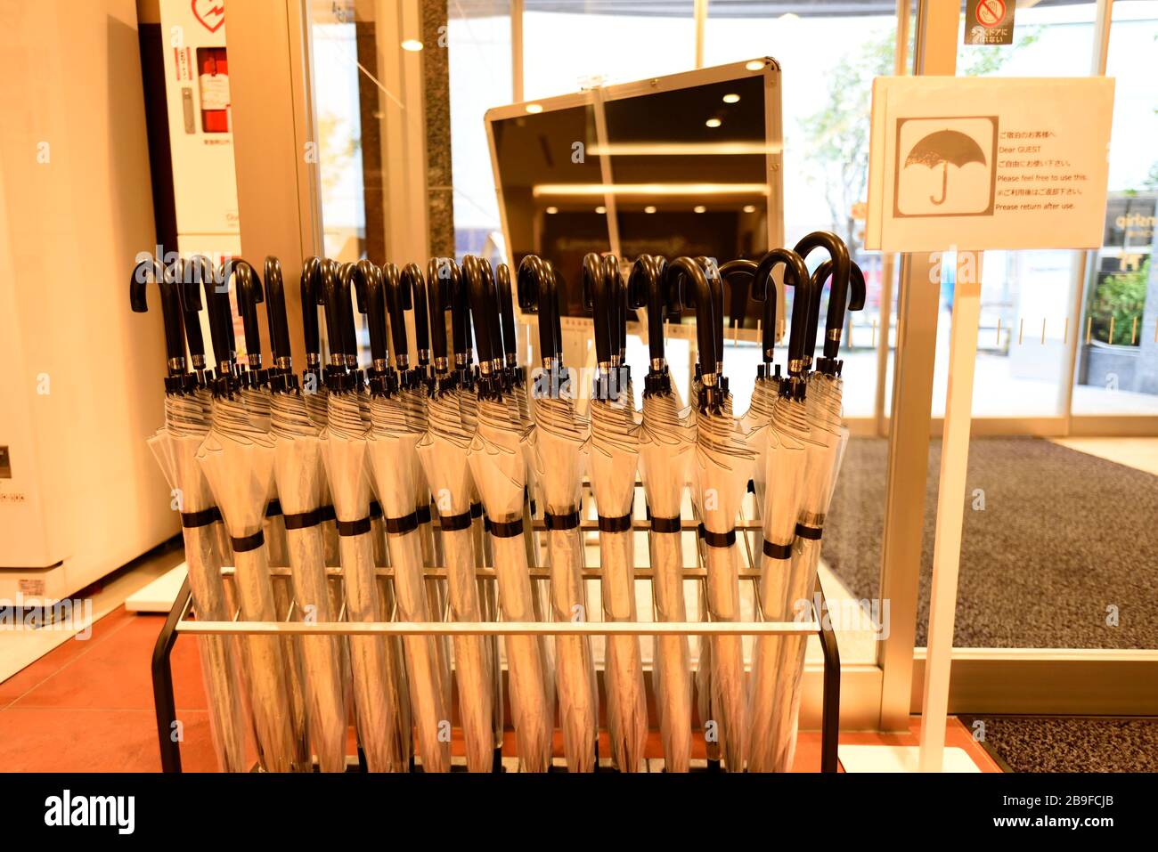 umbrella rack in hotel lobby Japan Stock Photo - Alamy