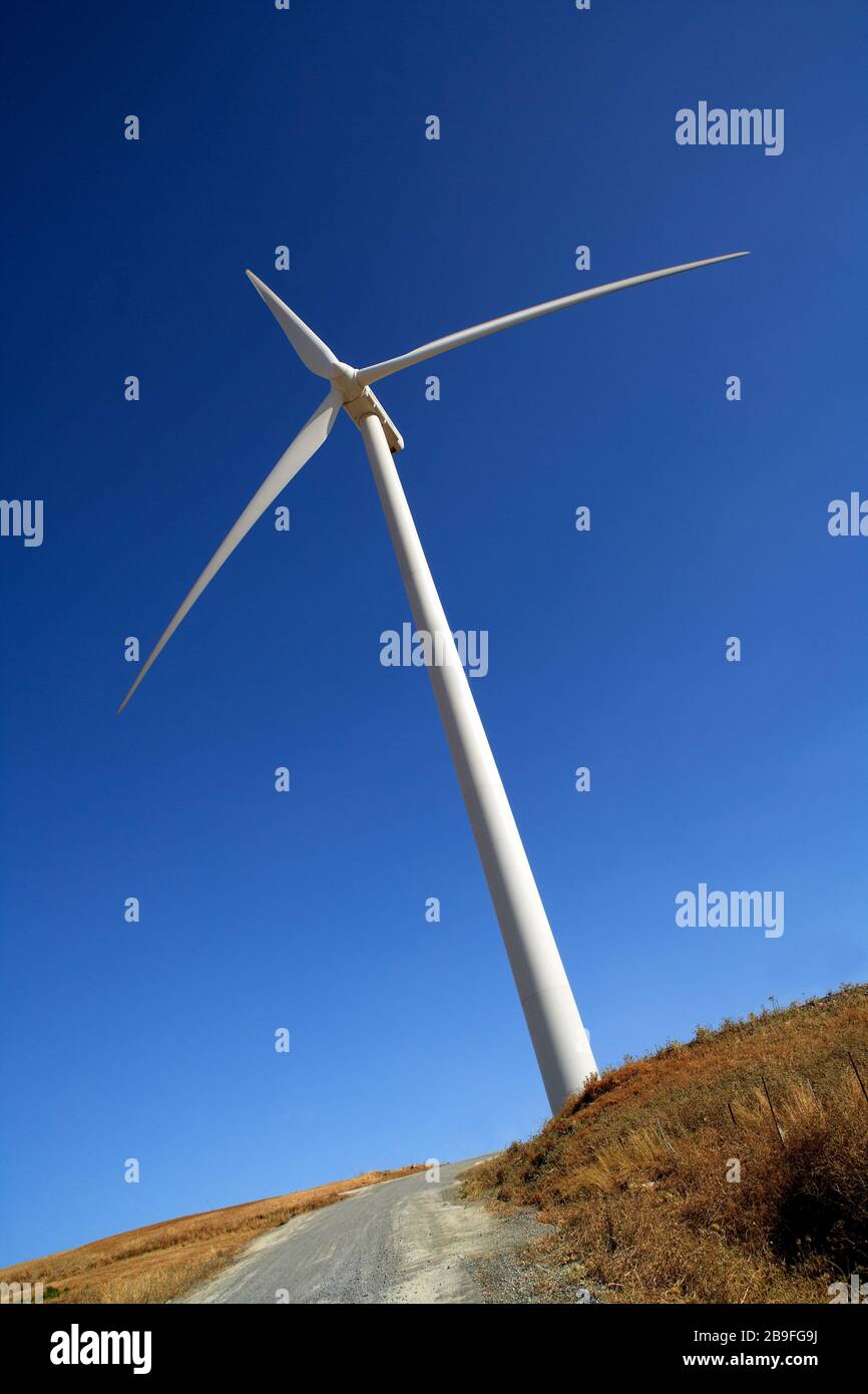 single wind turbine on wind farm from low angle with blue sky Stock ...