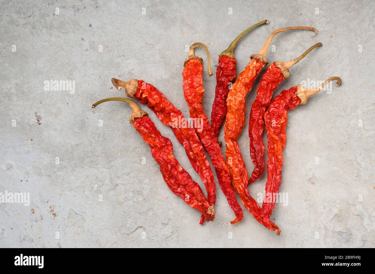 Natural Dried Red Hot Peppers on a Cement Background Stock Photo - Alamy