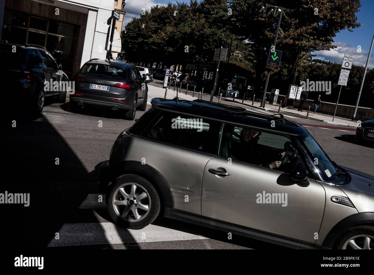A woman drives a mini on the roads of Verona, Italy Stock Photo - Alamy