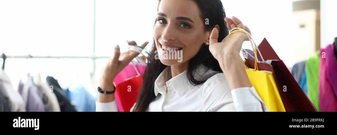 Smiling lady in fashionable store Stock Photo - Alamy