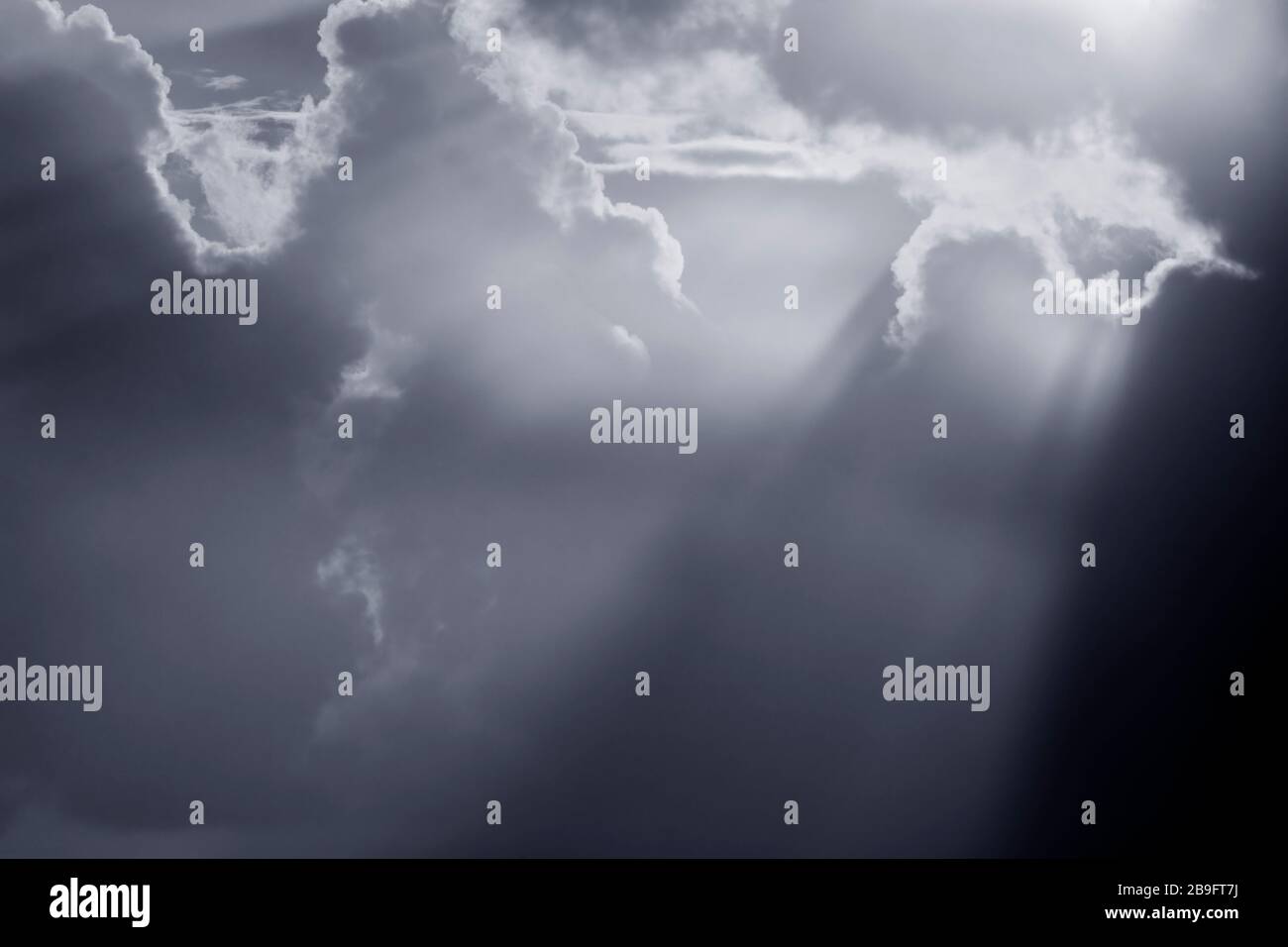 Cloudscape with sun rays. Used infrared filter. Toned blue Stock Photo ...