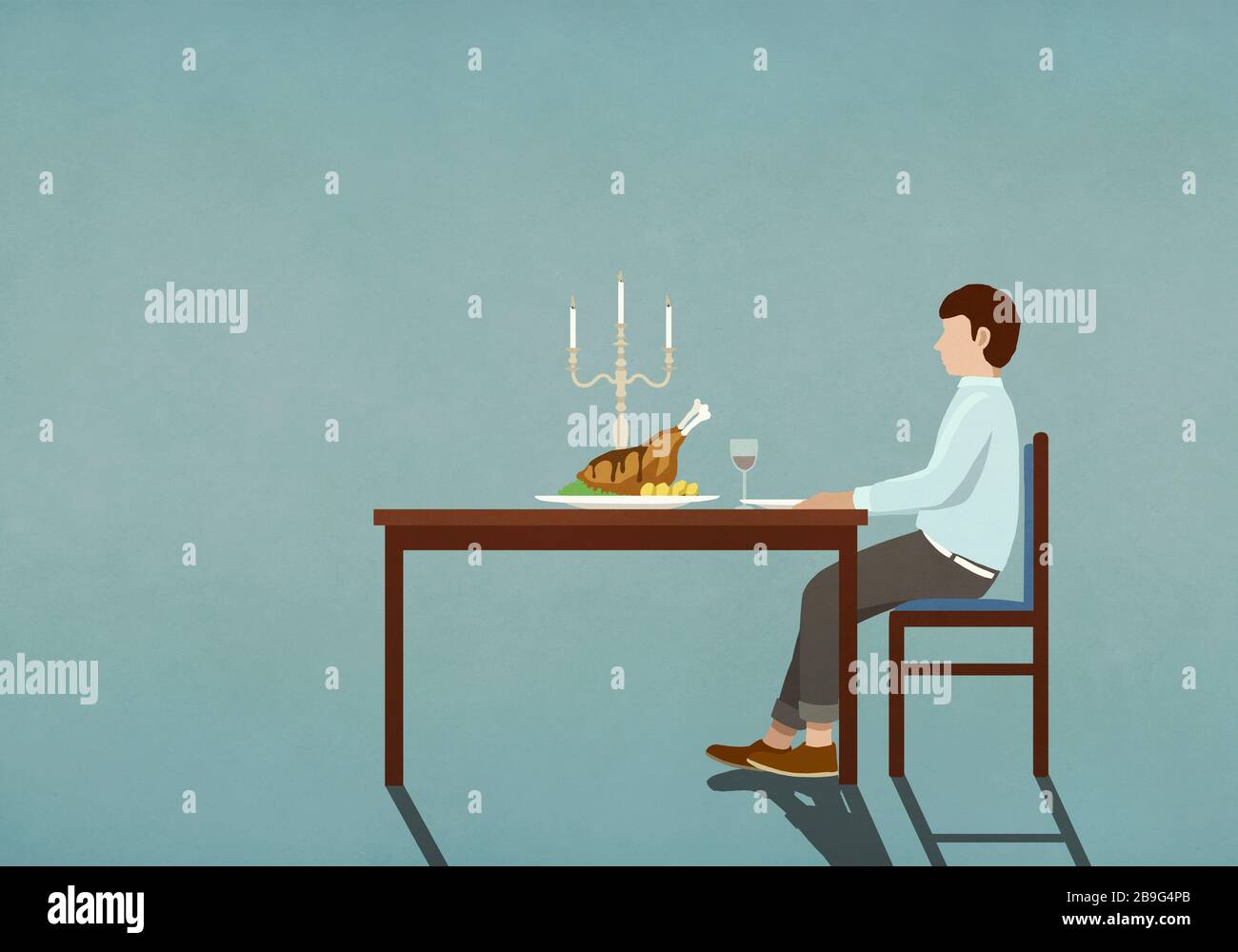 Man enjoying candlelight dinner alone at table Stock Photo - Alamy