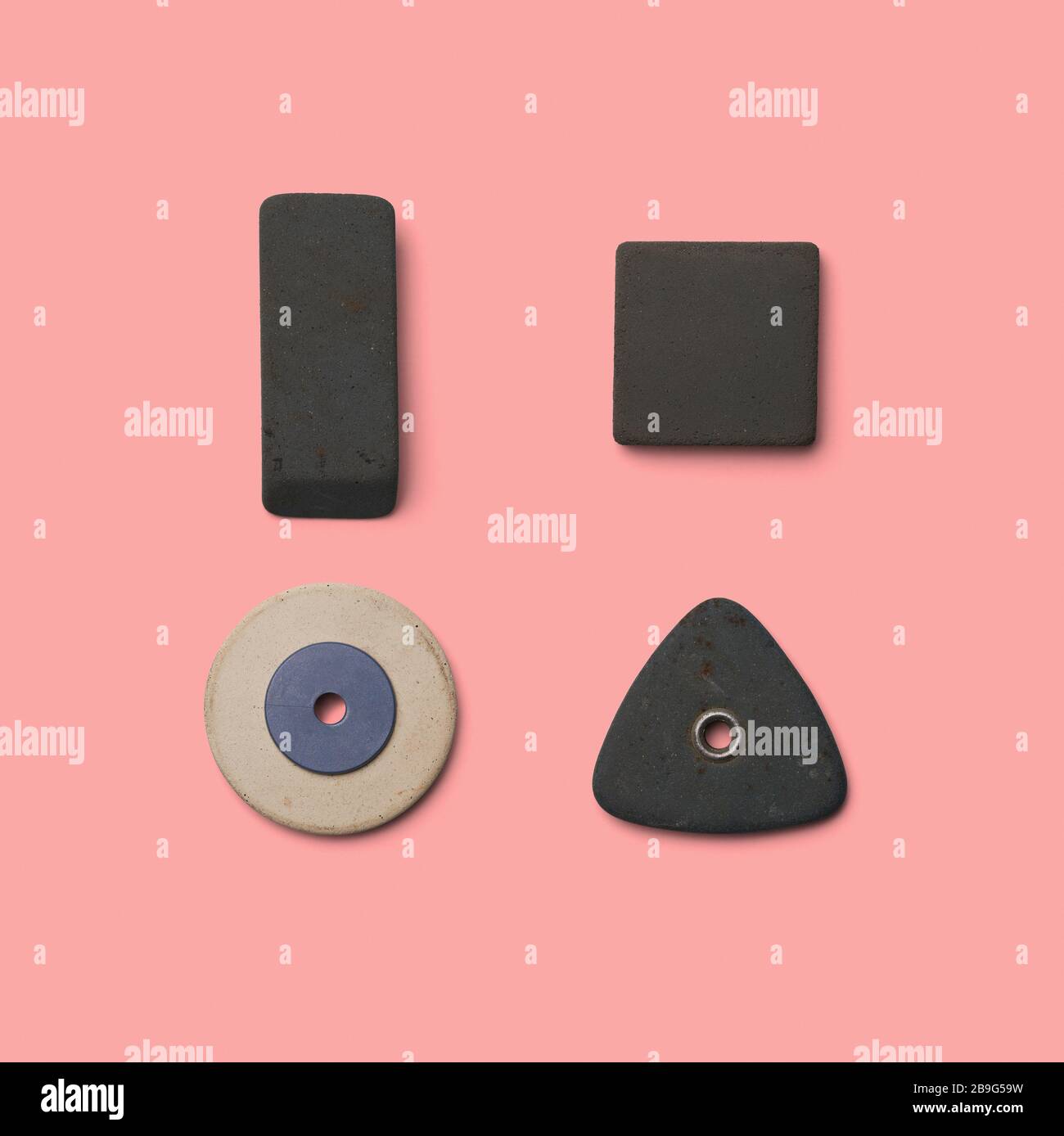 Rubber pieces in various shapes on pink background Stock Photo - Alamy