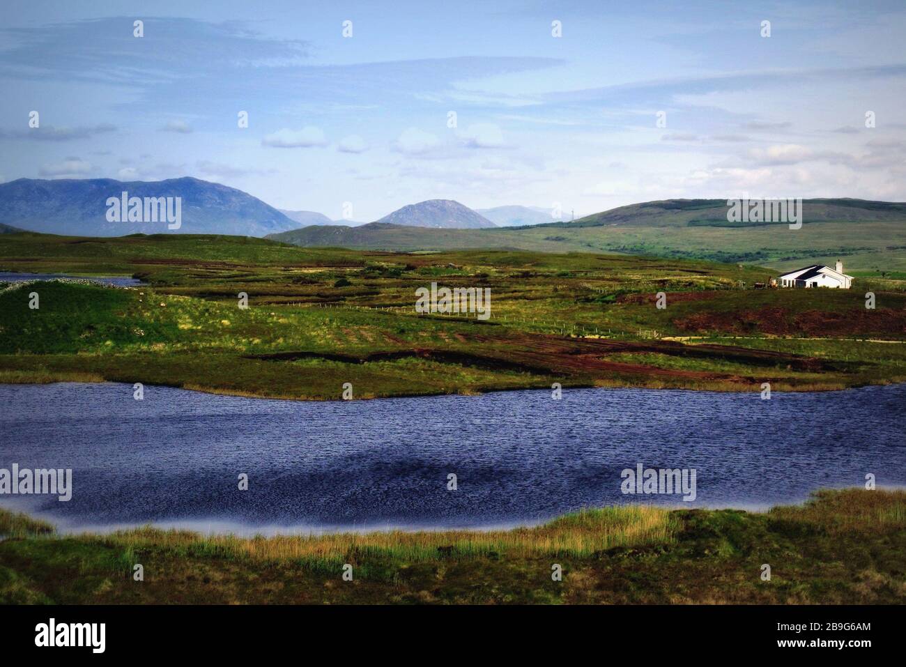 windy day in the Connemara mountains, landscape with blue wavy lake ...
