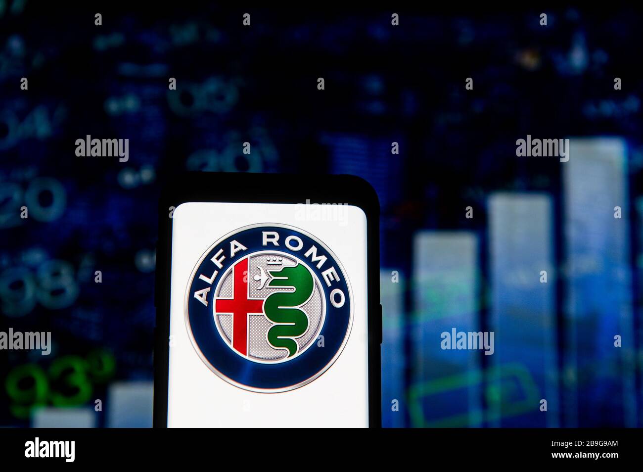 In this photo illustration an Alfa Romeo logo seen displayed on a ...