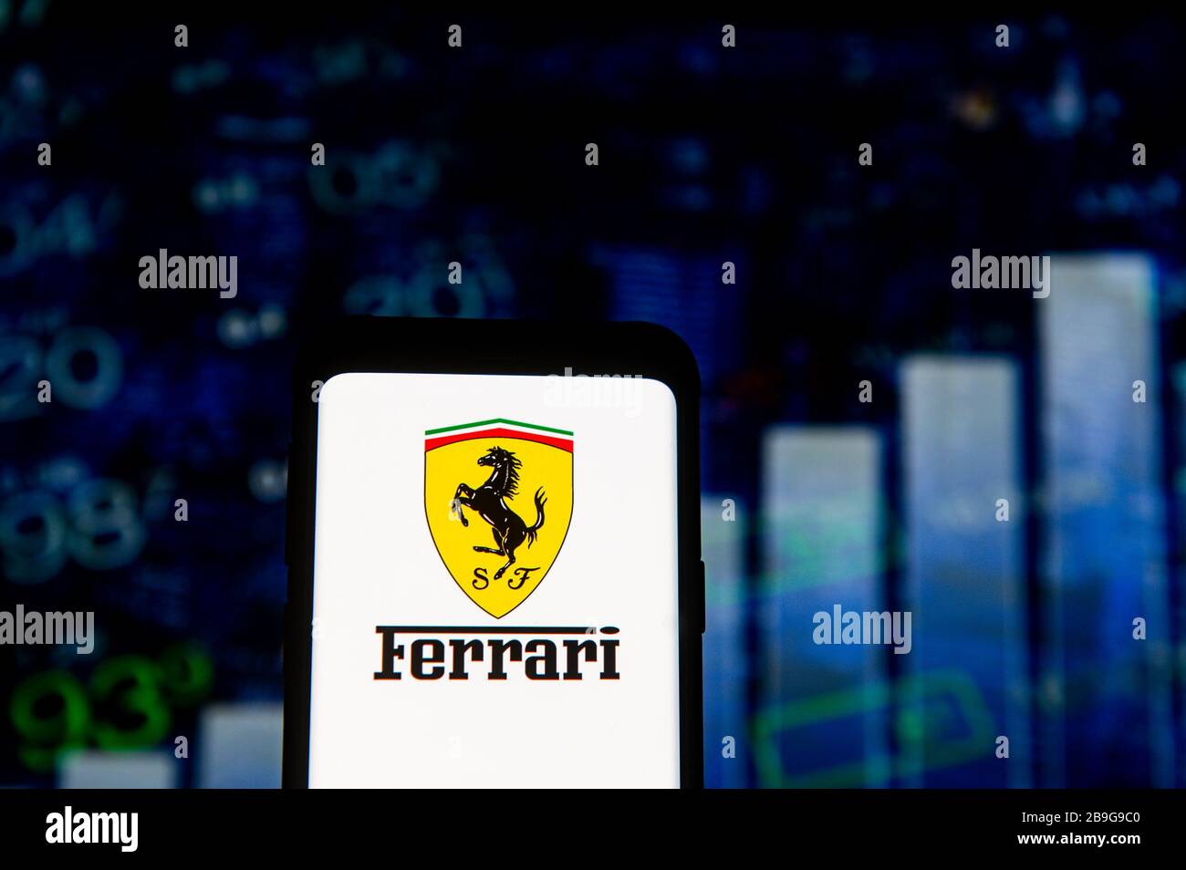 In this photo illustration a Ferrari logo seen displayed on a ...