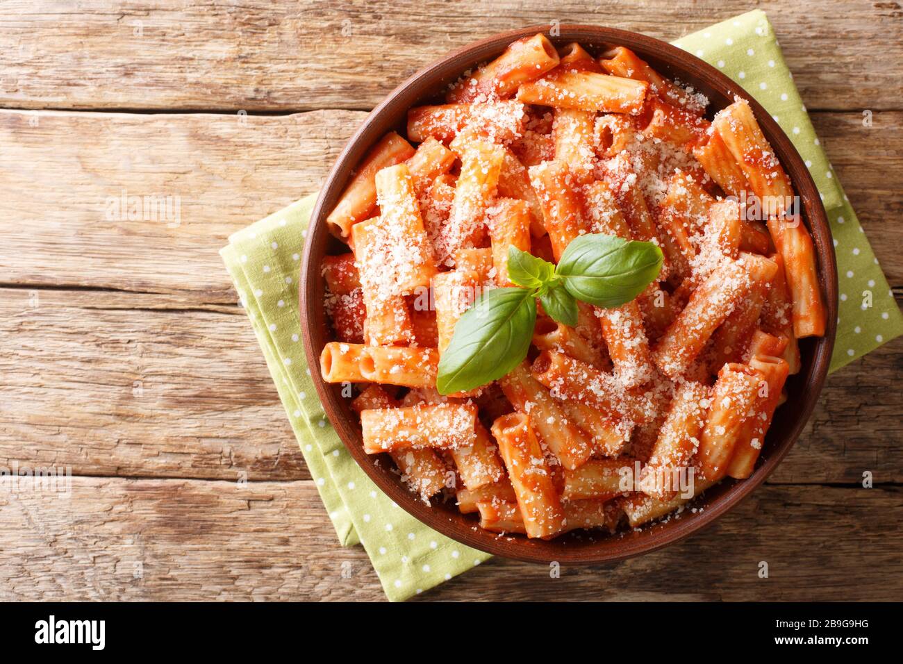 Italian homemade Tortiglioni pasta with parmesan basil in tomato sauce ...