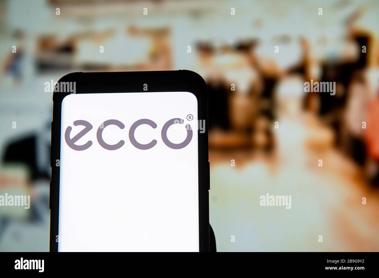 In this photo illustration an Ecco logo seen displayed on a smartphone ...