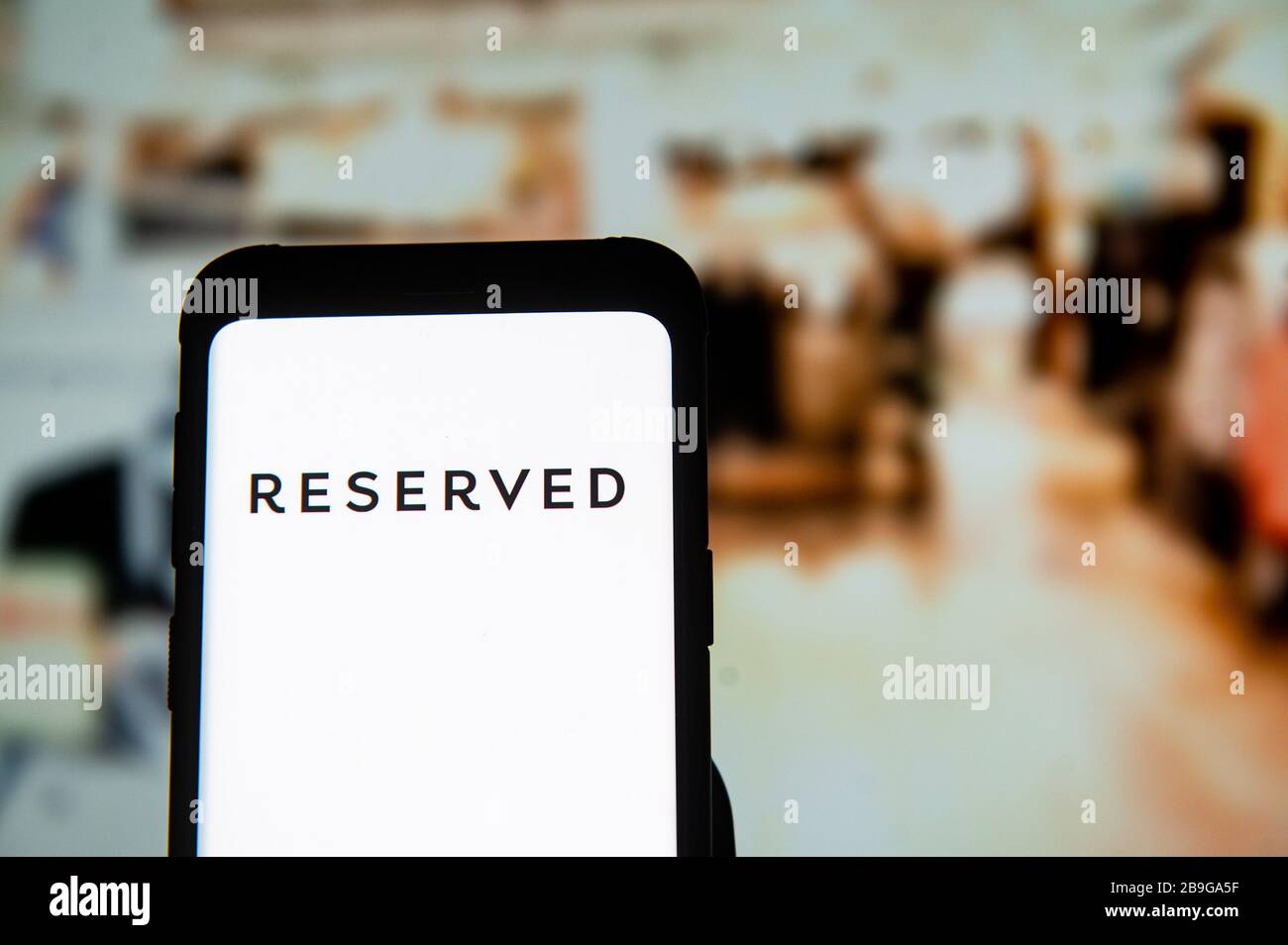 In this photo illustration a Reserved logo seen displayed on a ...