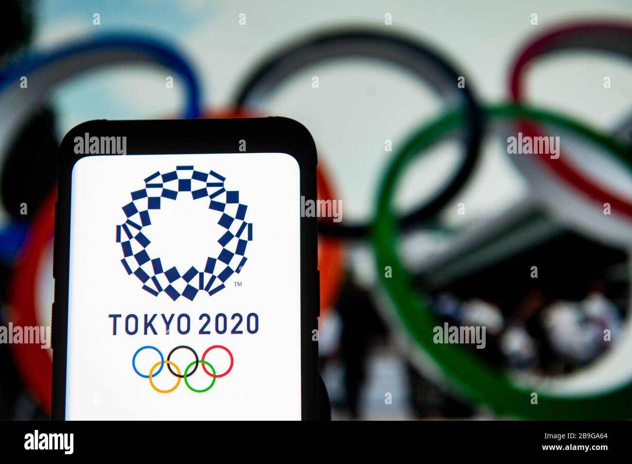 In this photo illustration a Tokyo 2020 Olympics logo seen displayed on ...