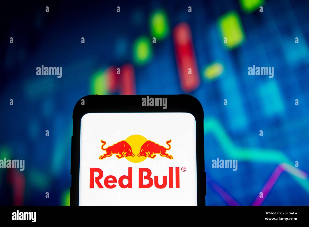 In this photo illustration a Red Bull logo seen displayed on a ...