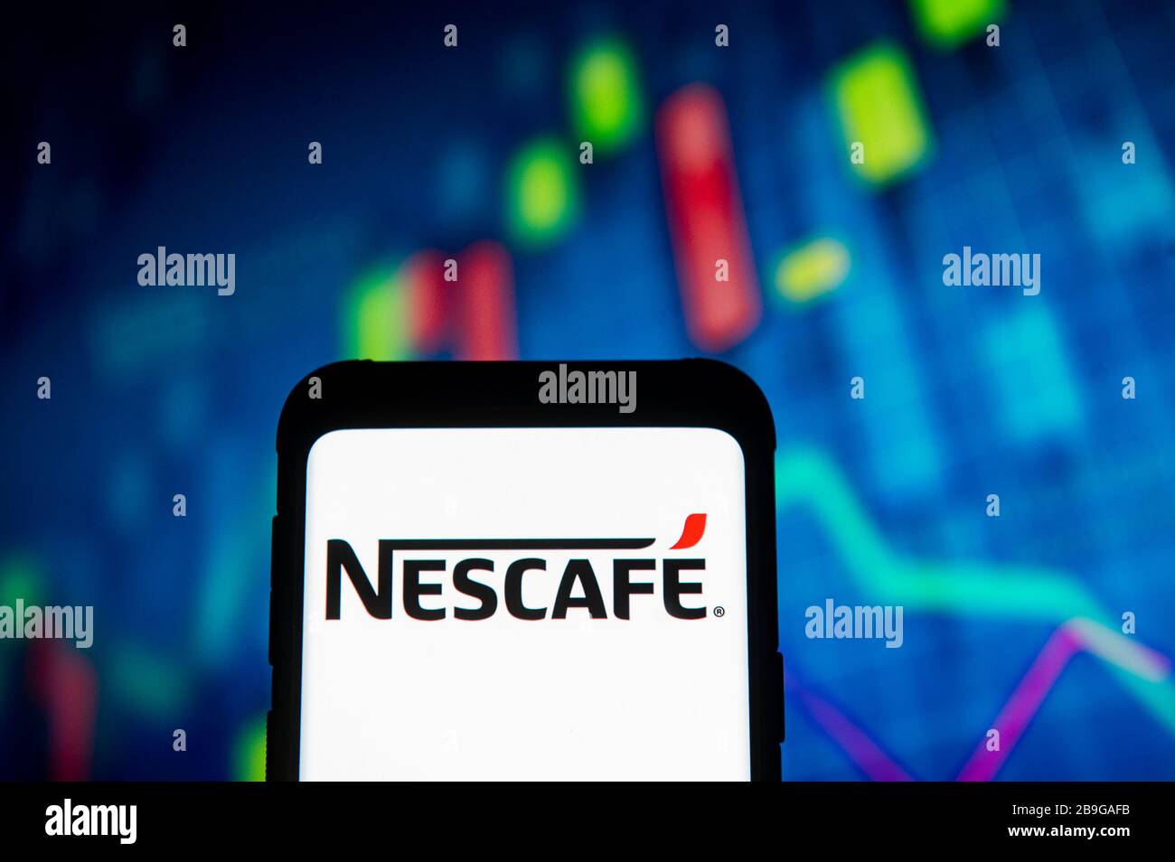 In this photo illustration a Nescafe logo seen displayed on a ...
