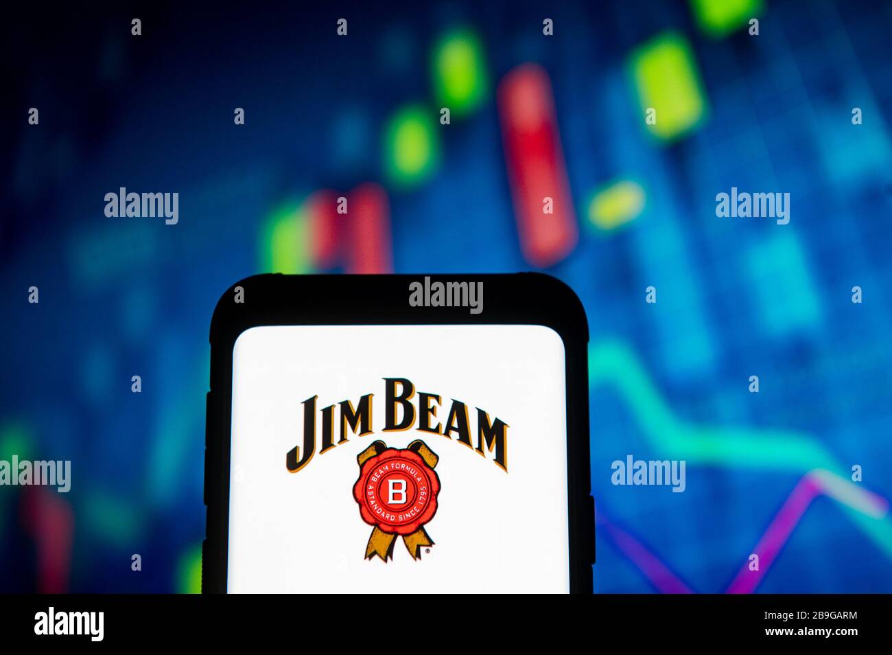 In this photo illustration a Jim Beam logo seen displayed on a ...