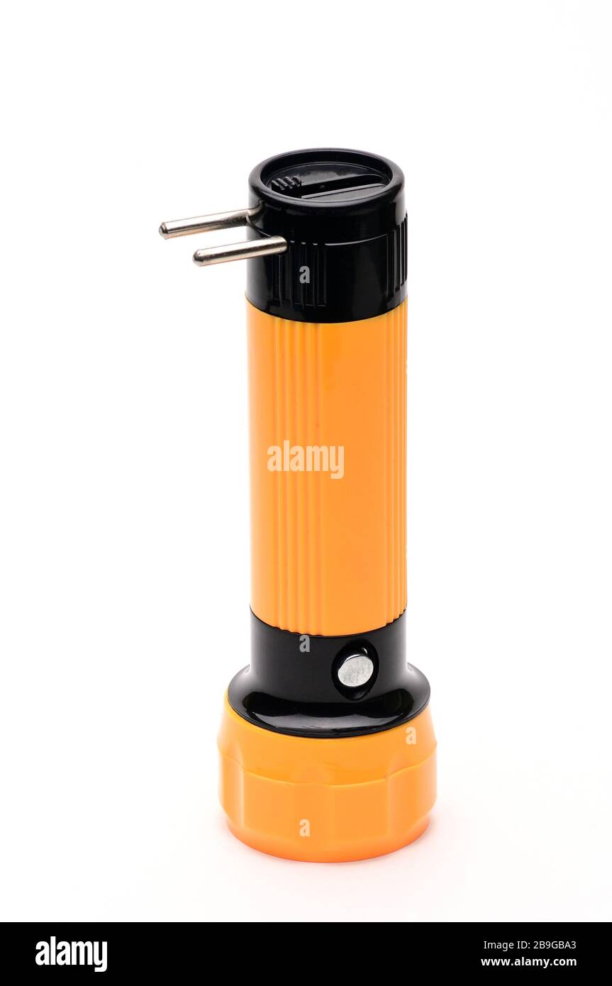 Yellow LED flashlight with the ability to recharge from the mains on an ...