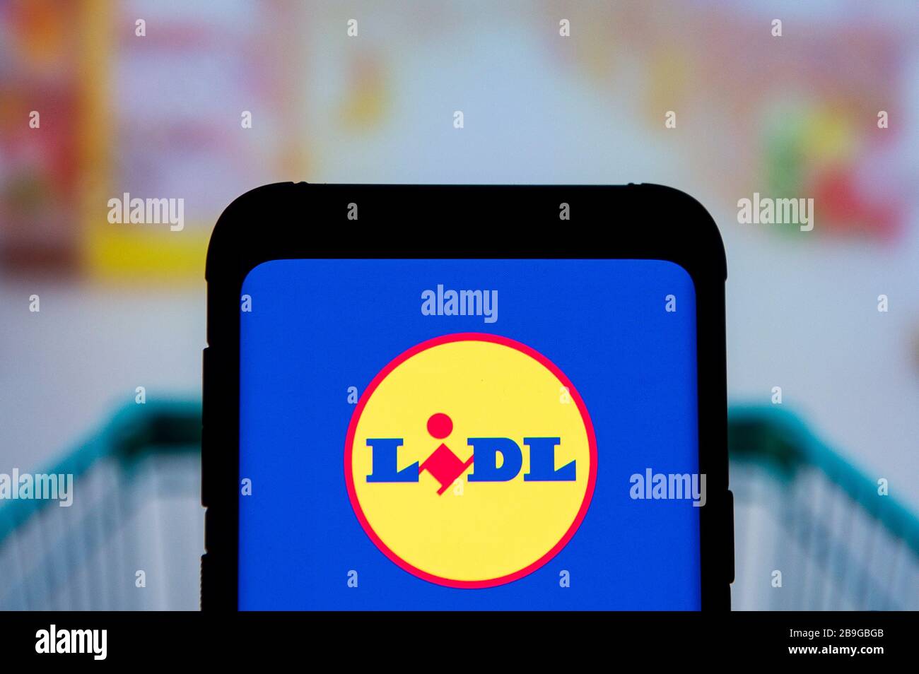 In this photo illustration a Lidl logo seen displayed on a smartphone ...