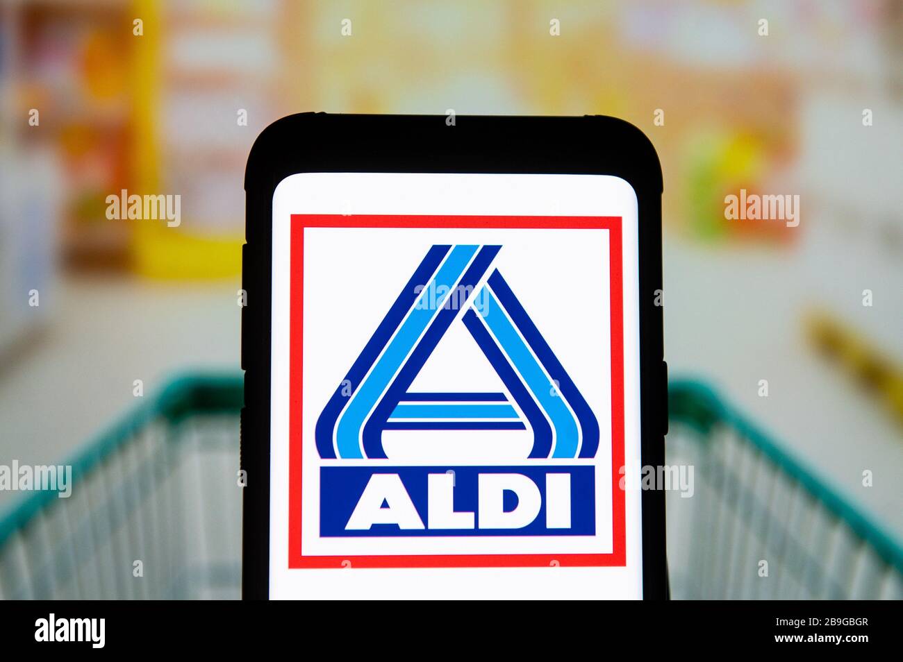 In this photo illustration an Aldi logo seen displayed on a smartphone ...