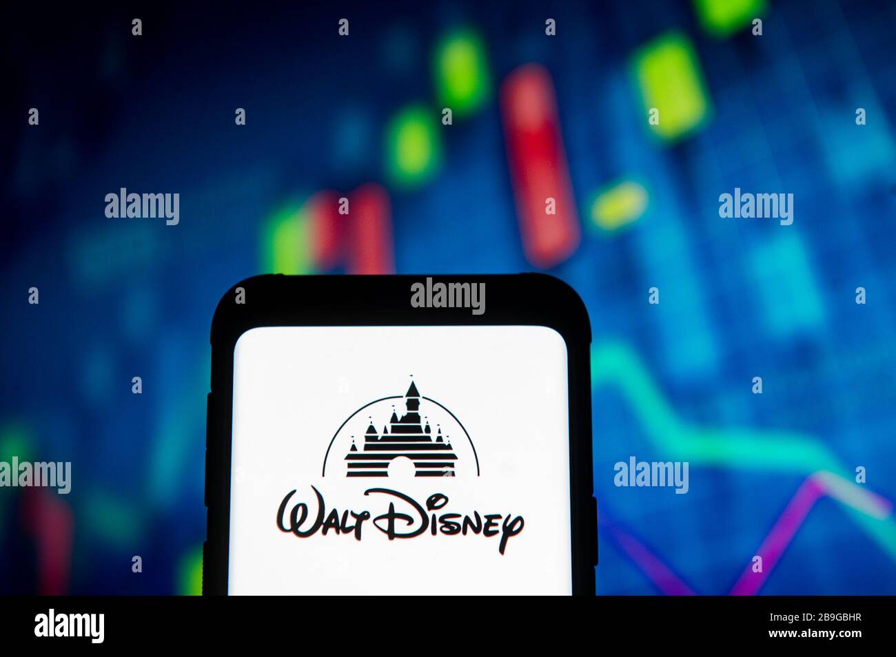 In this photo illustration a Walt Disney logo seen displayed on a ...