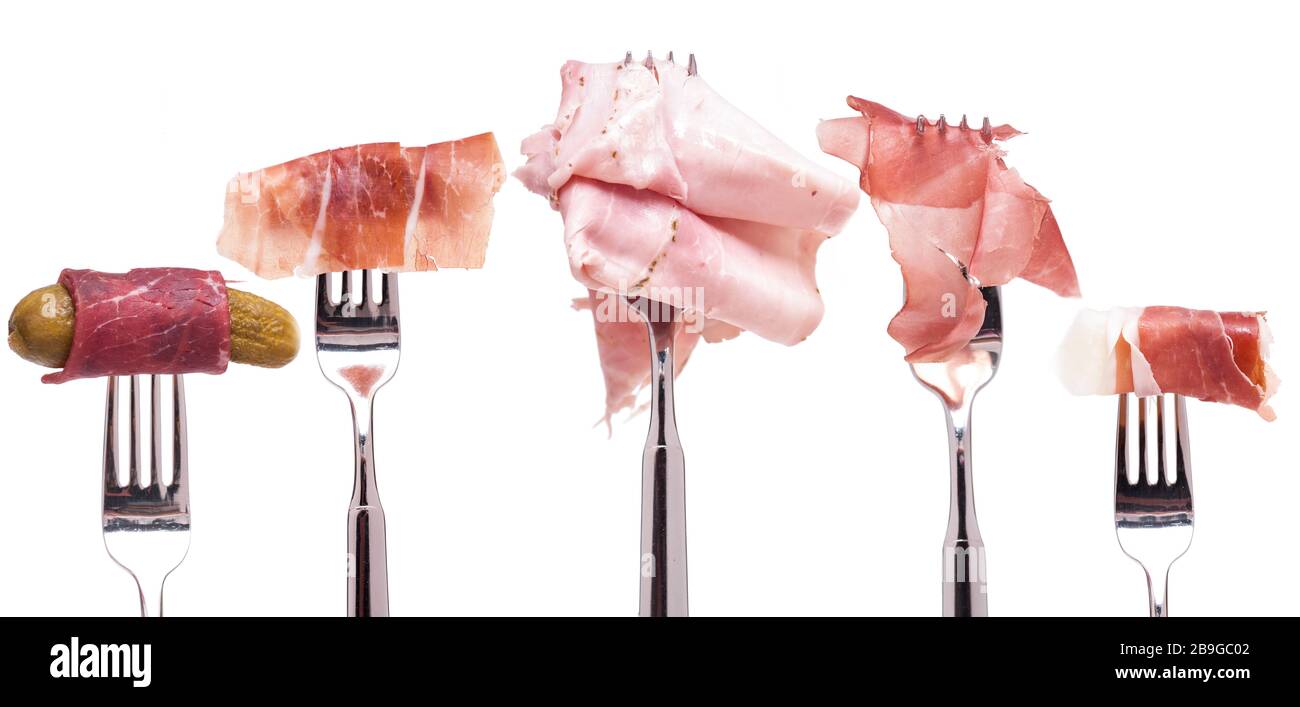 Different ham on fork white isolated Stock Photo - Alamy