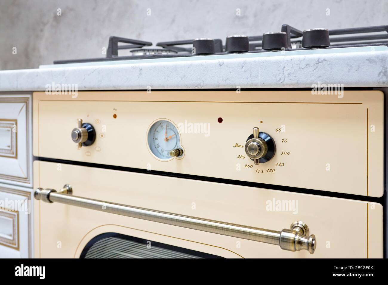 Modern built-in oven and gas stove classic design in beige tones under ...