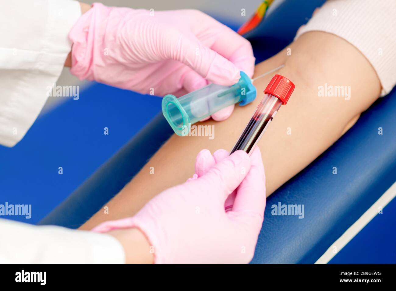 Nurse taking blood sample from patient for analysis of coronavirus ...