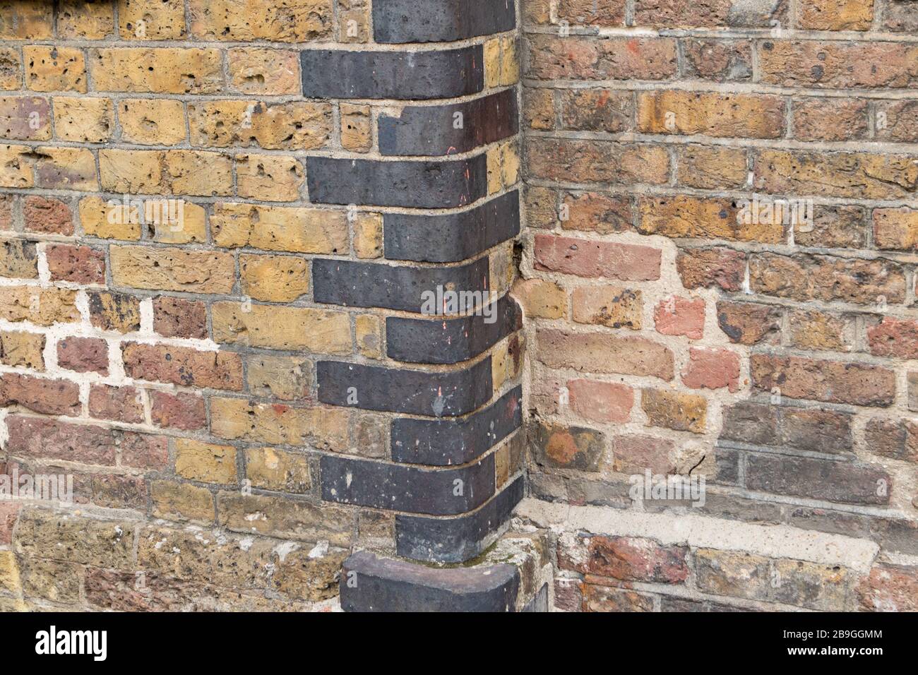 Mixed bricks used to rebuild a warehouse wall in the regeneration of ...