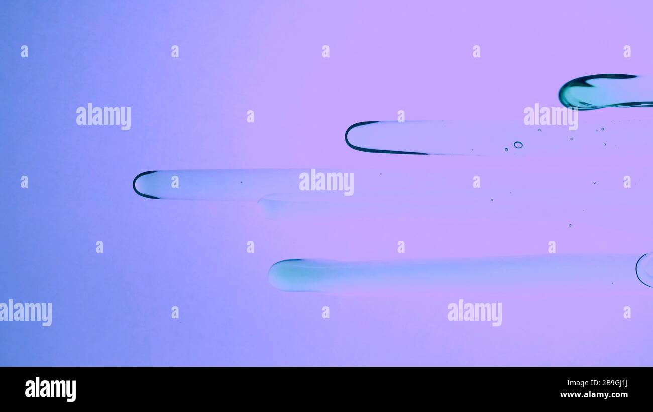 Horizontally moving green-blue translucent glowing liquid, dripping ...