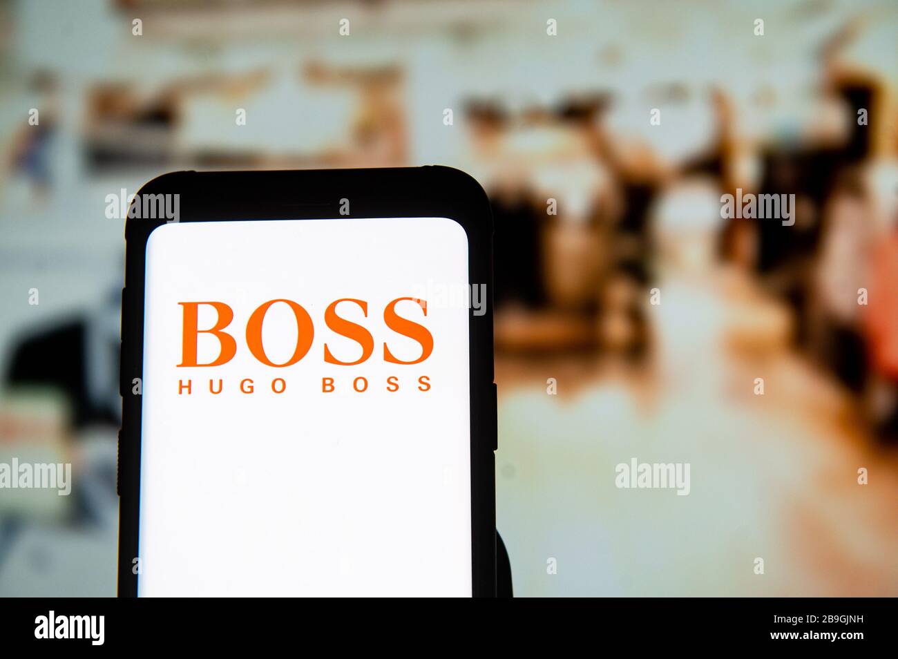 Poland. 23rd Mar, 2020. In this photo illustration a Hugo Boss logo ...