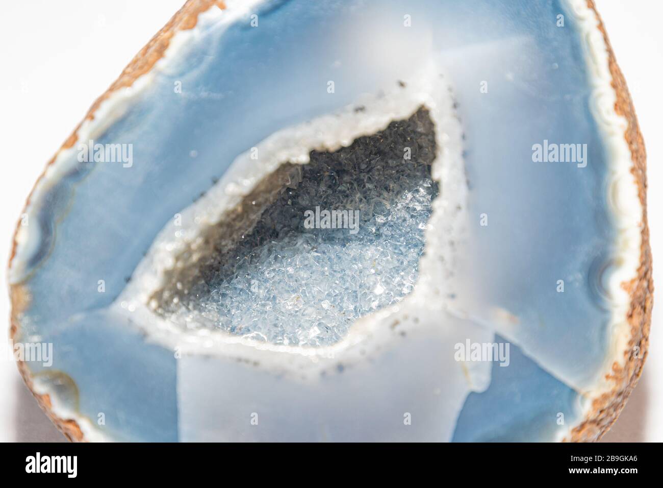 Blue colored geode outside looking like usual rock inside full of tiny ...