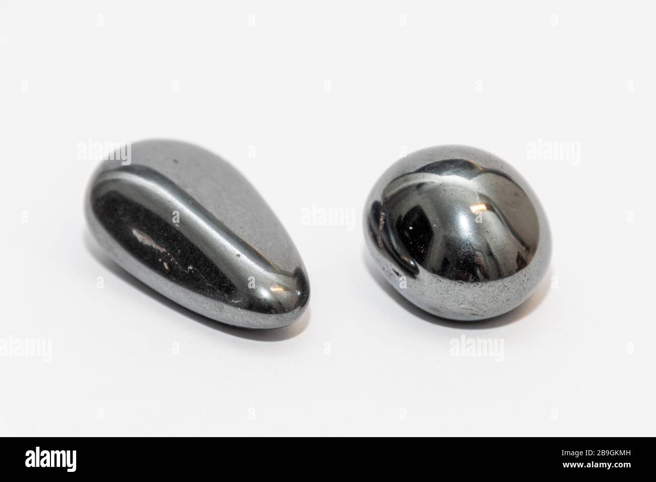 Metallic looking round and highly polished rare gems Stock Photo - Alamy