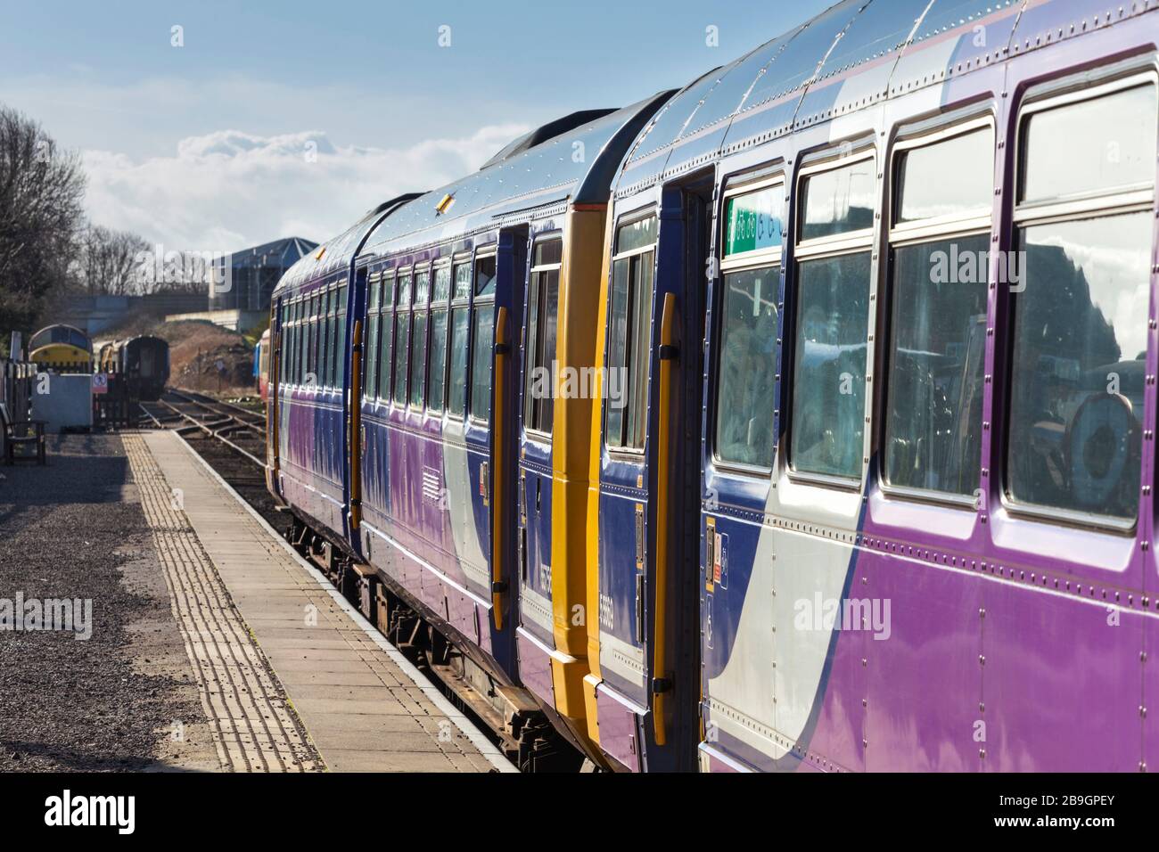 View looking down the side of class 142 pacer trains 142060 + 142028 ...
