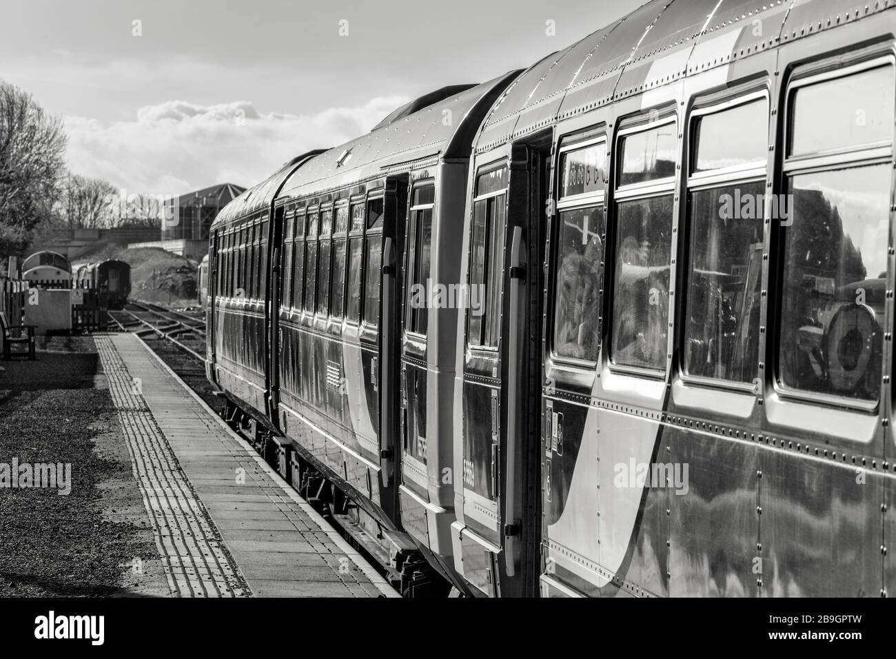 View looking down the side of class 142 pacer trains 142060 + 142028 ...