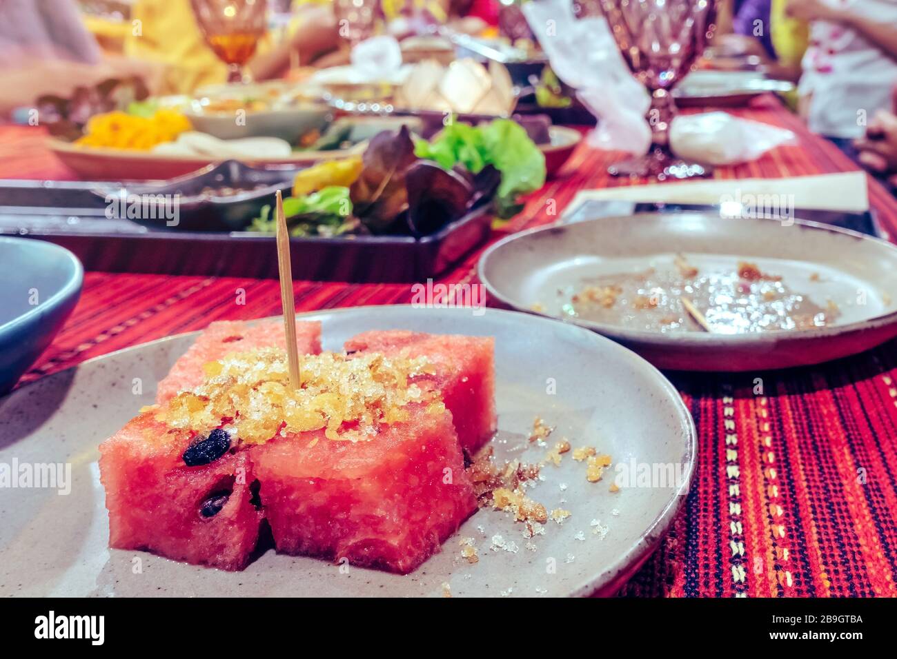 Fried dried fish with watermelon served as a dessert for party dinner ...