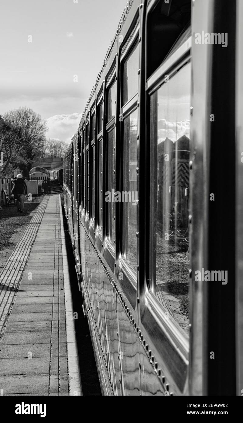 View looking down the side of class 142 pacer trains 142060 + 142028 ...