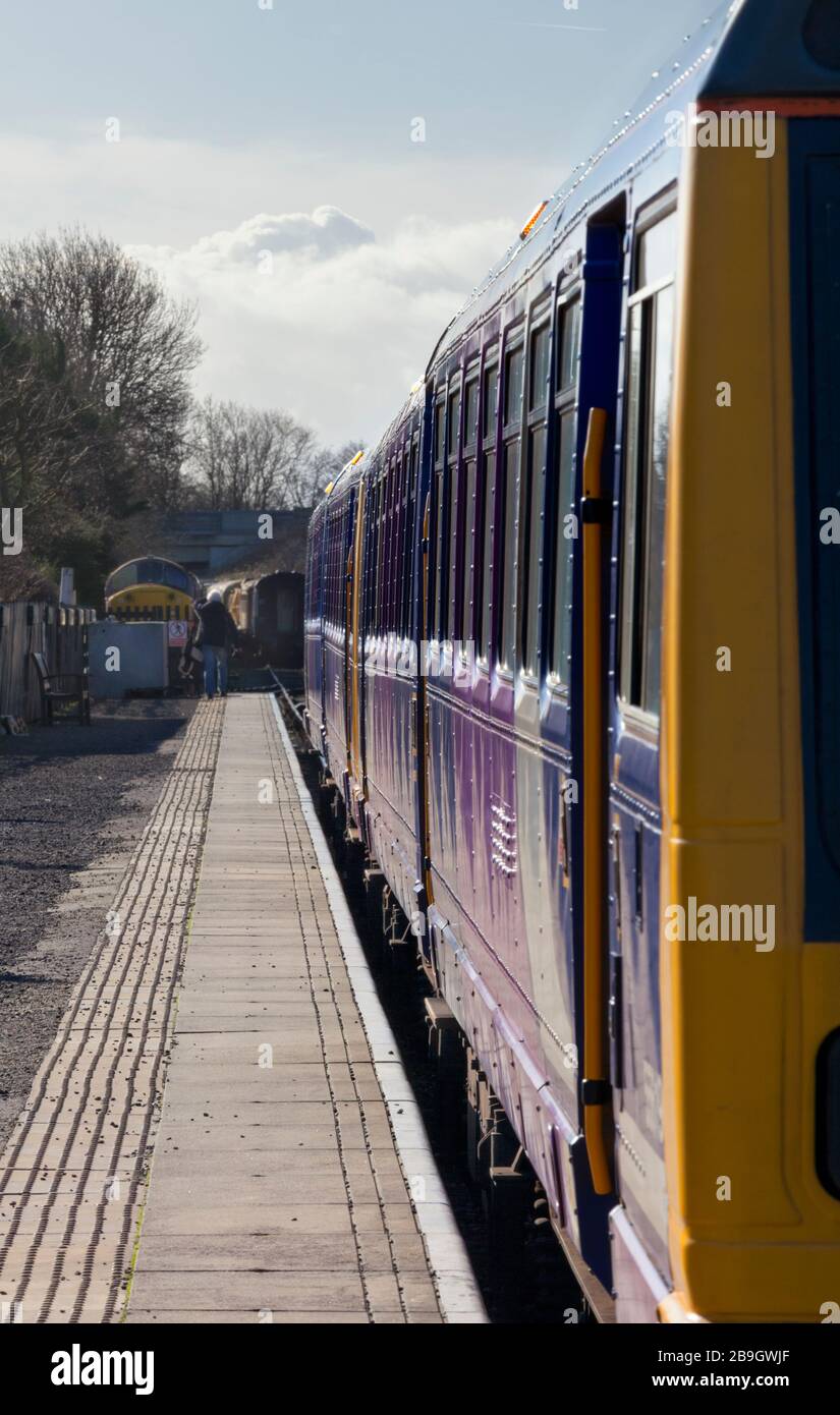 View looking down the side of class 142 pacer trains 142060 + 142028 ...