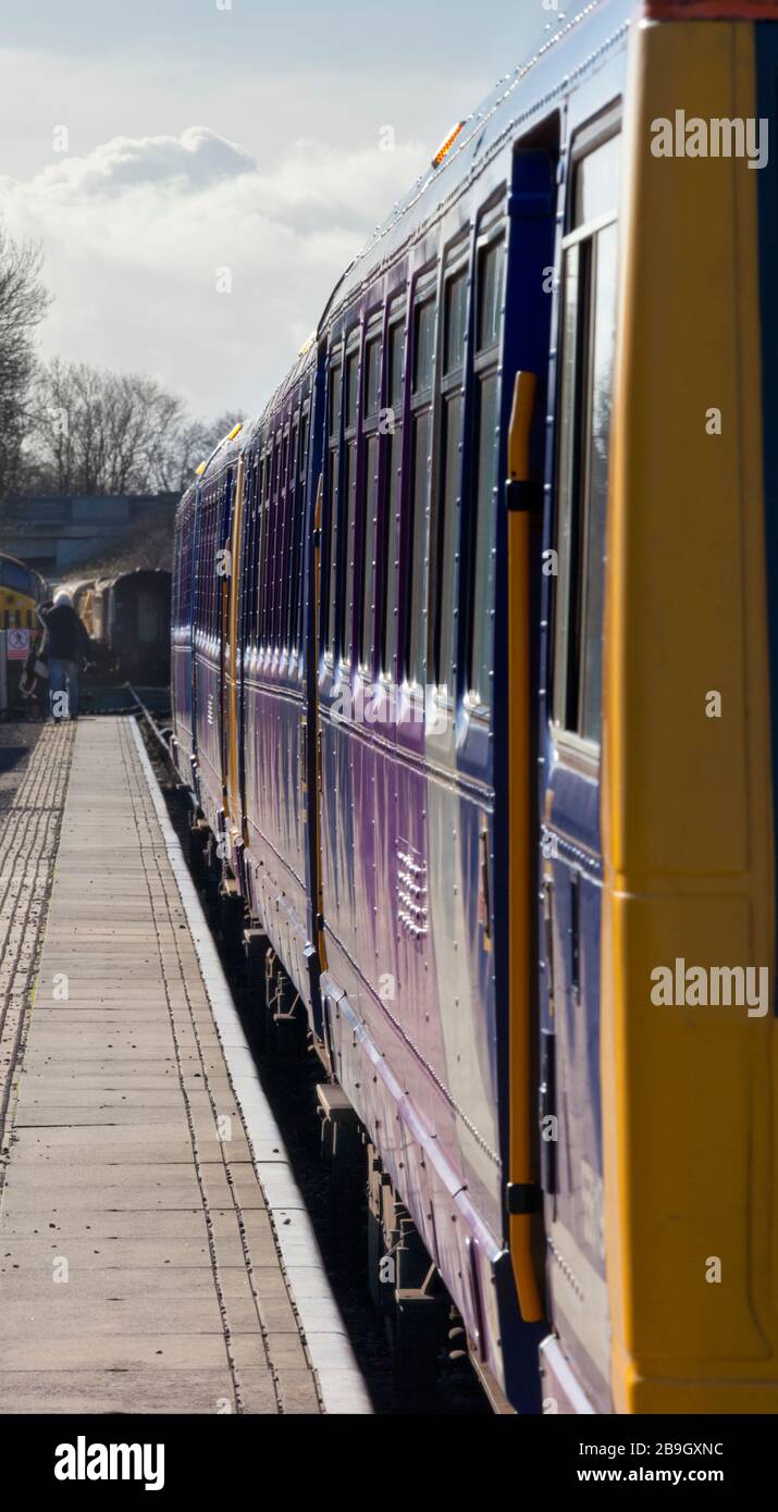 View looking down the side of class 142 pacer trains 142060 + 142028 ...