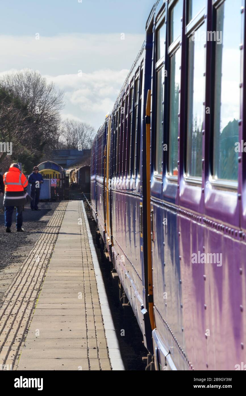 View looking down the side of class 142 pacer trains 142060 + 142028 ...