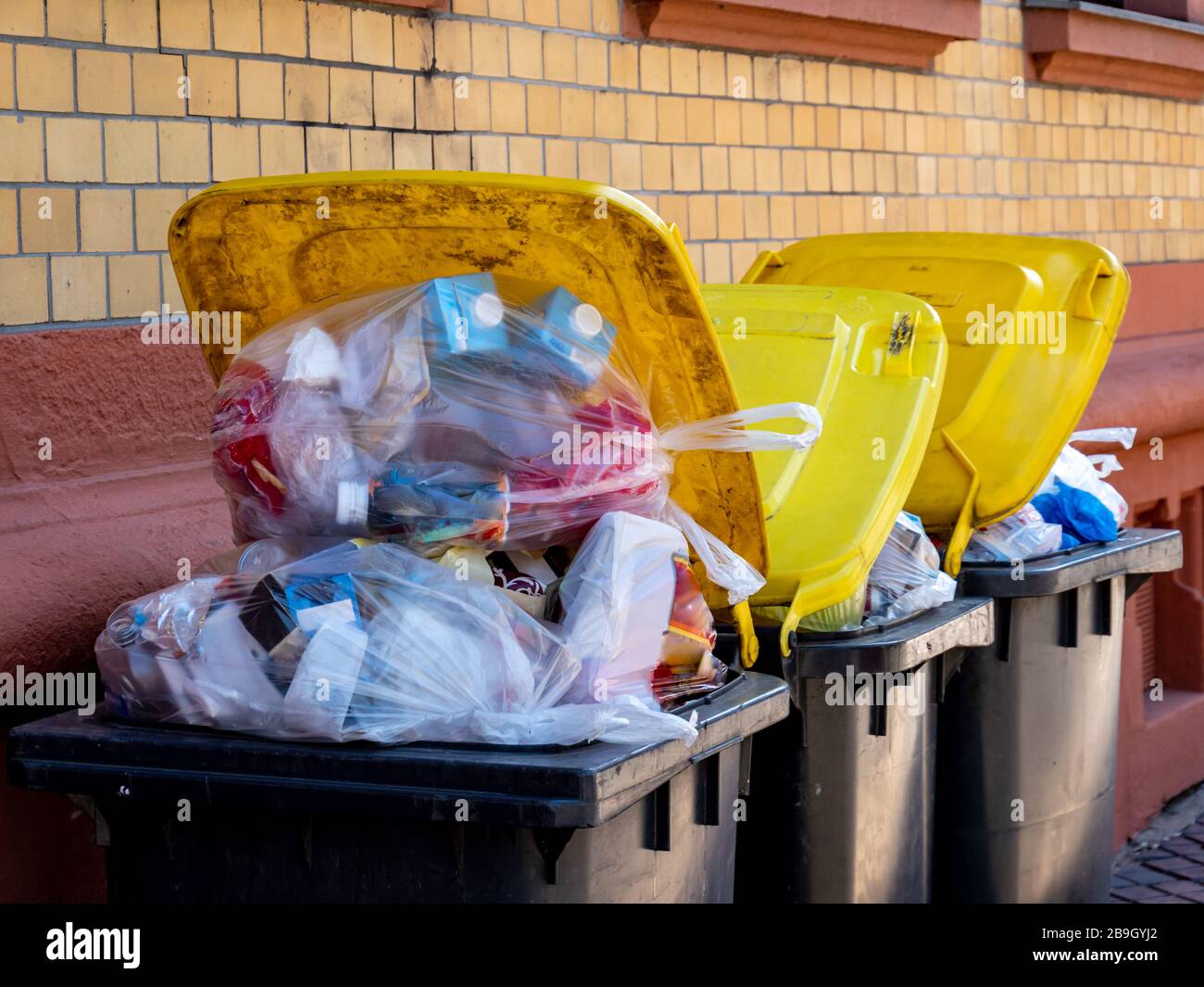 Full garbage bins plastic of the city Stock Photo - Alamy