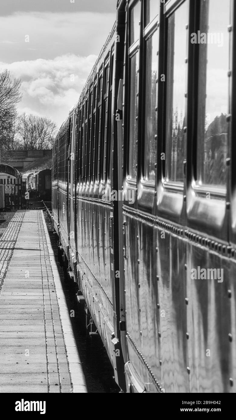 View looking down the side of class 142 pacer trains 142060 + 142028 ...